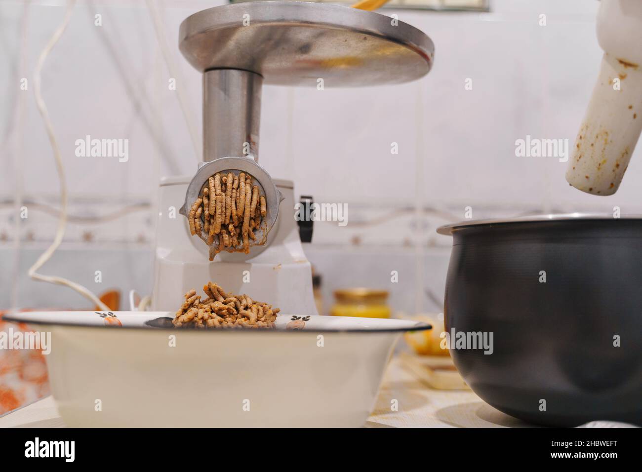 Meat grinder at home kitchen. Lifestyle photography. Food preparing ...