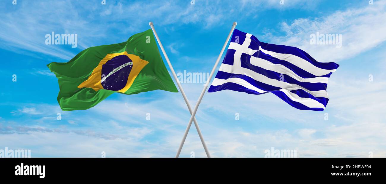 crossed national flags of Brazil and Greece flag waving in the wind at ...