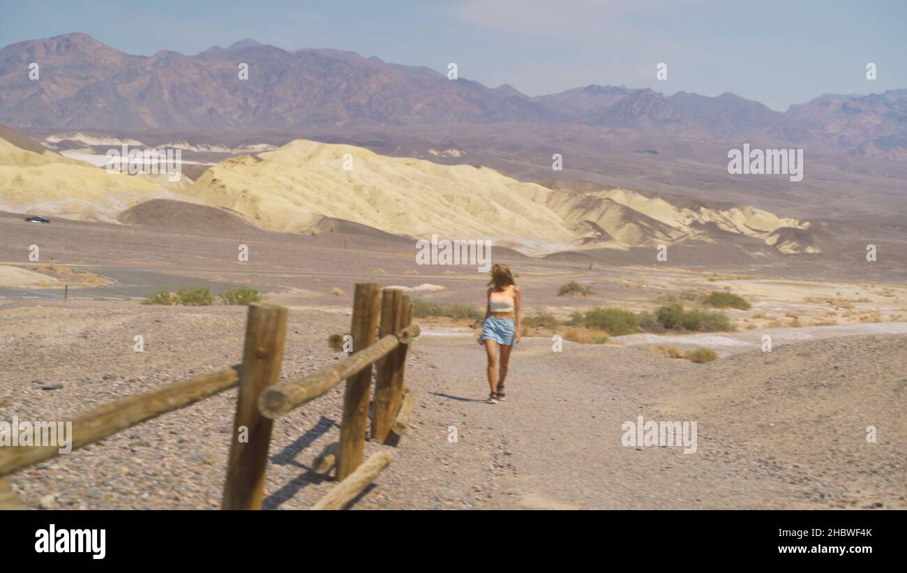 Young pretty woman exploring remains of industrial workings at the old ...