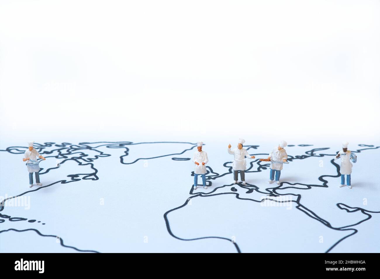 Four miniature chefs on the map of Europe Stock Photo - Alamy