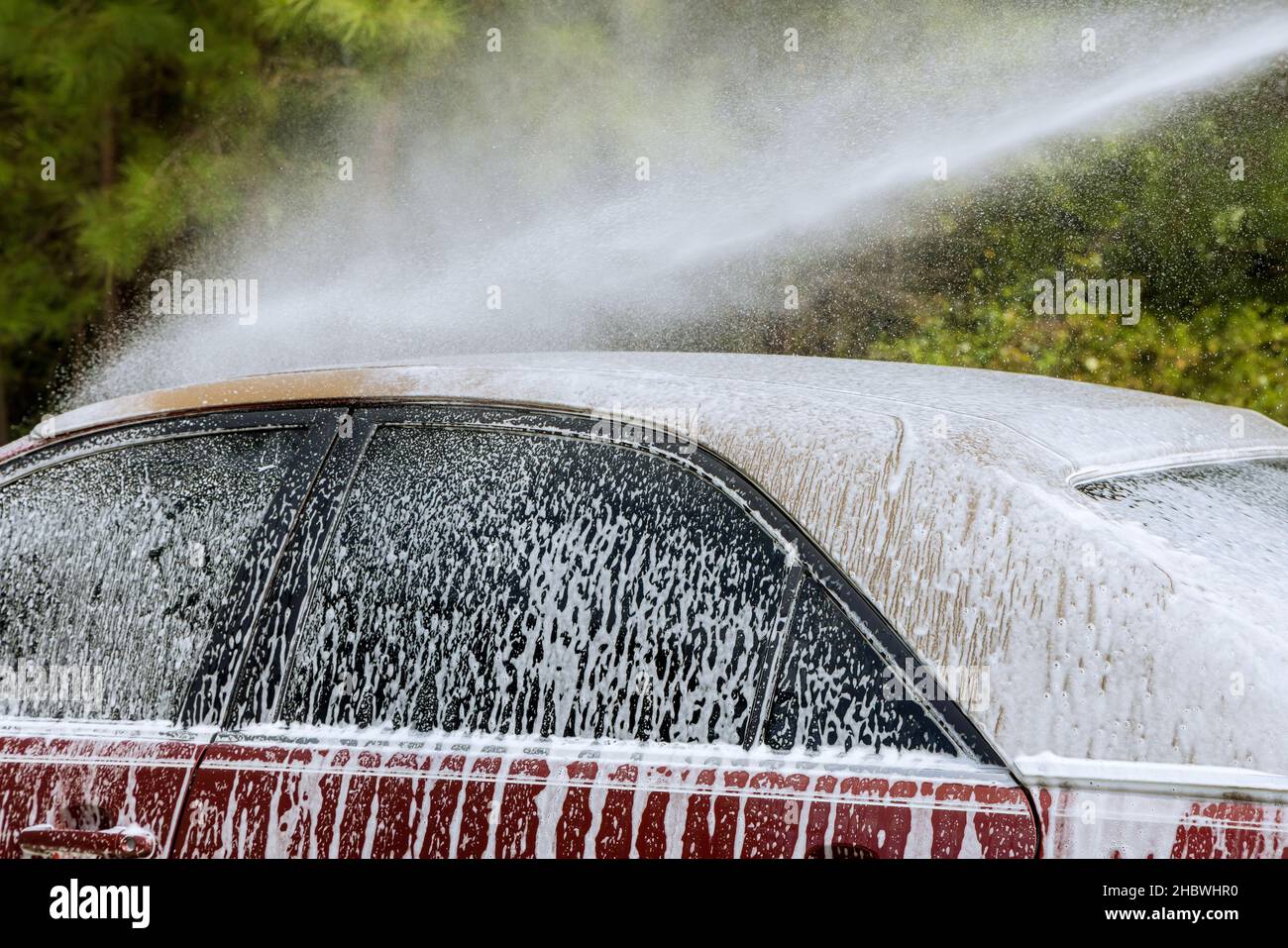 Car washing cleaning service using high-pressure water Stock Photo - Alamy