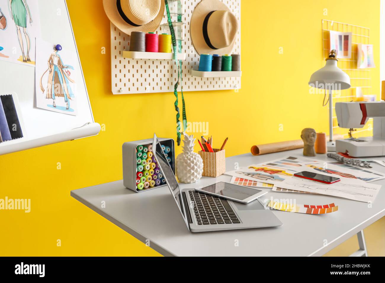 Workplace of modern clothes stylist in studio Stock Photo - Alamy