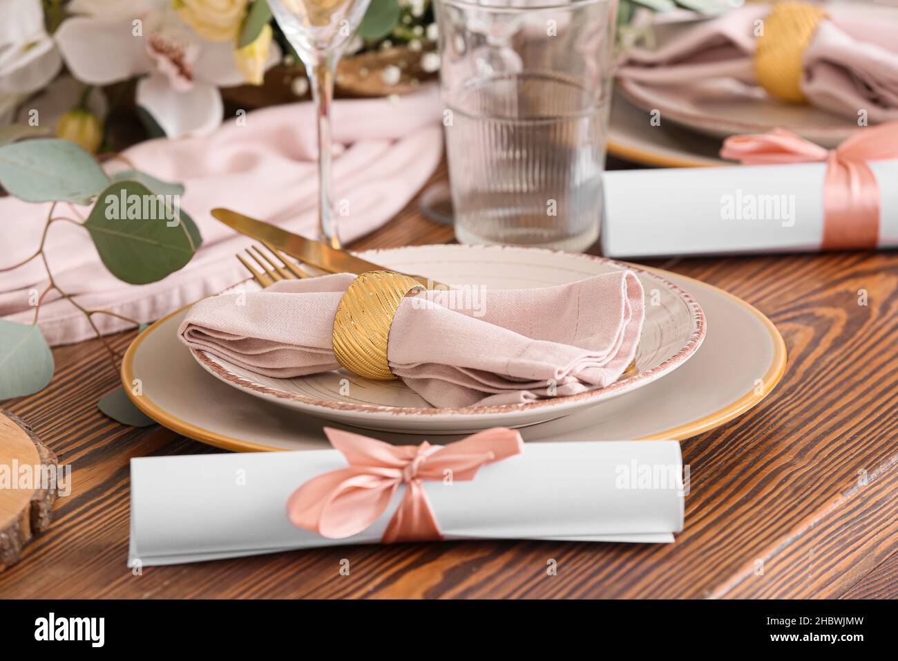 Beautiful table setting with wedding invitations Stock Photo - Alamy