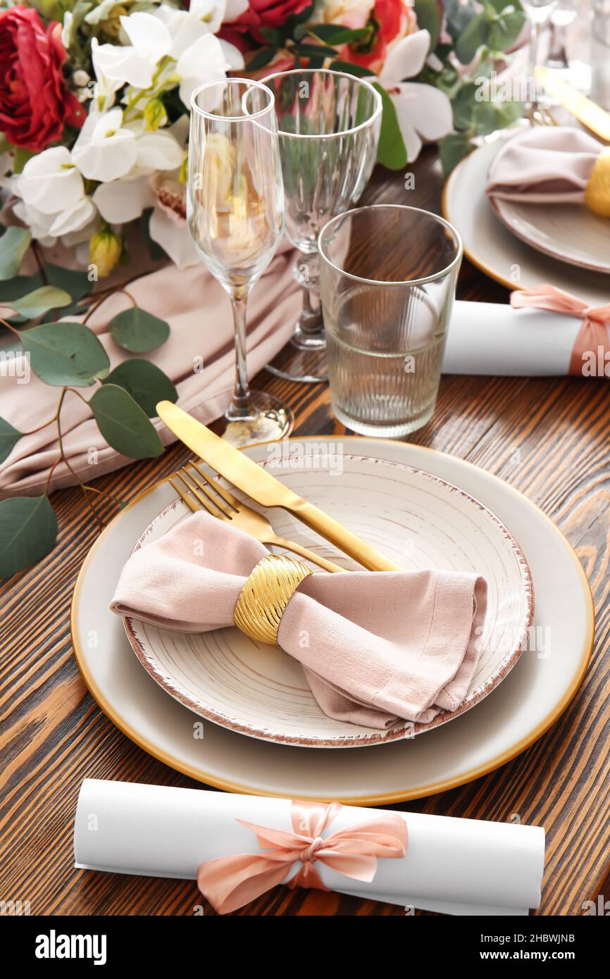 Beautiful table setting with wedding invitations Stock Photo - Alamy