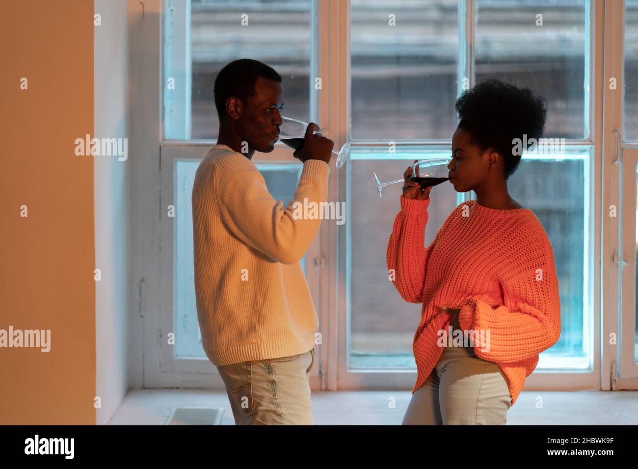 Young african couple enjoy romantic evening with wine at home, black ...
