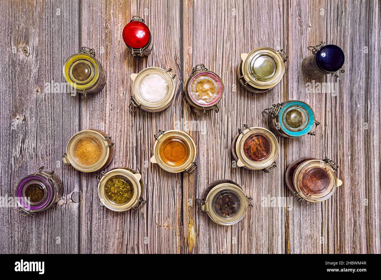 top view image of airtight jars with spices of all kinds on wooden ...