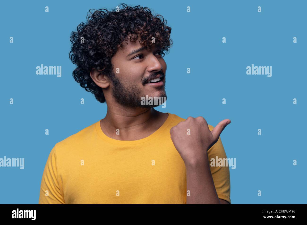 Male pointing sideways using the first digit of his hand Stock Photo ...