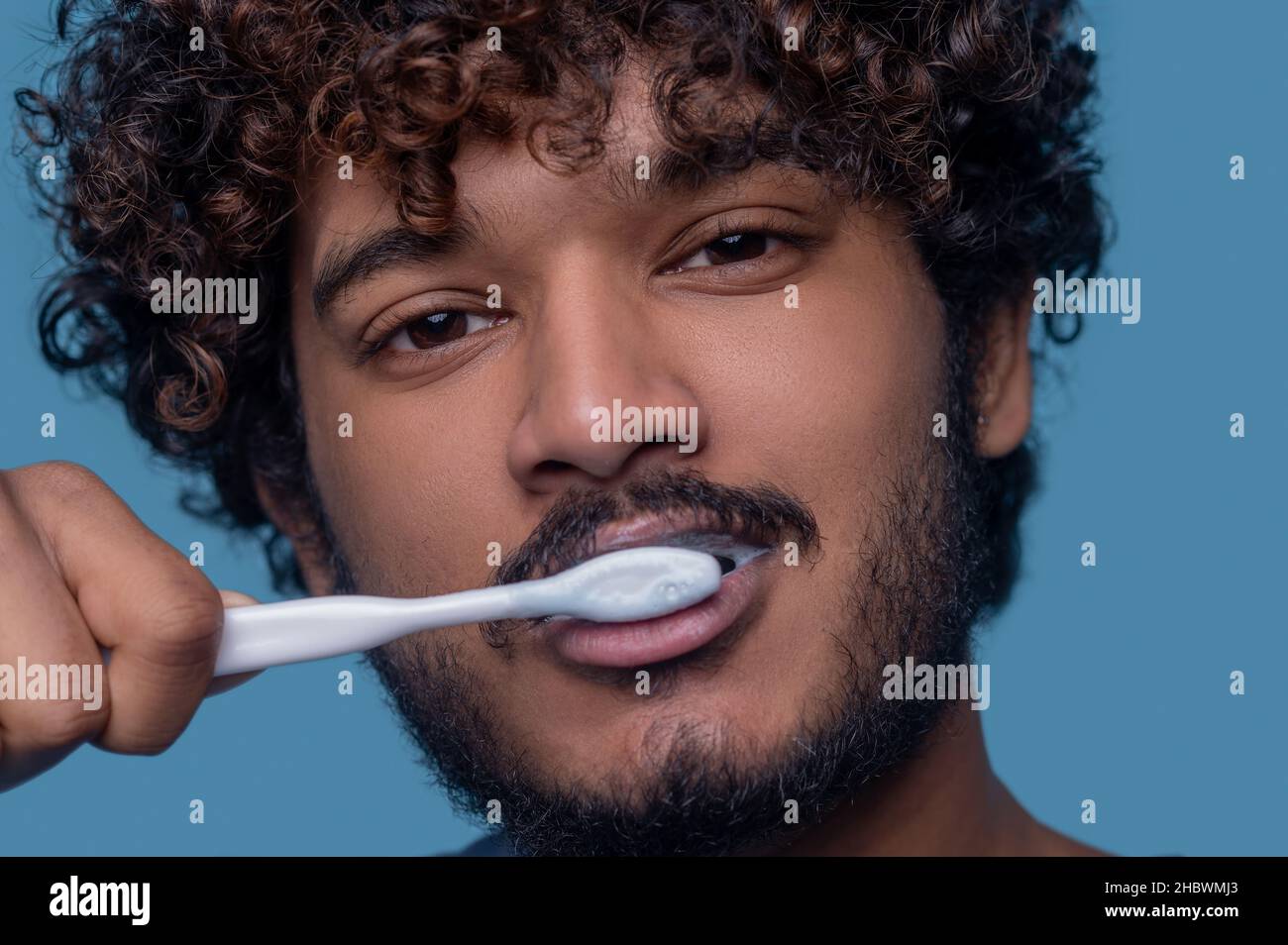 Handsome bearded man brushing teeth hi-res stock photography and images ...