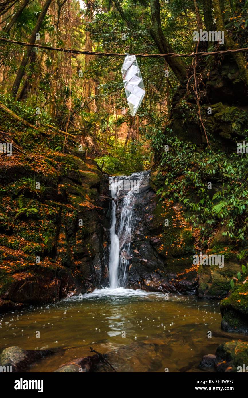 Small waterfall at twilight time Stock Photo - Alamy