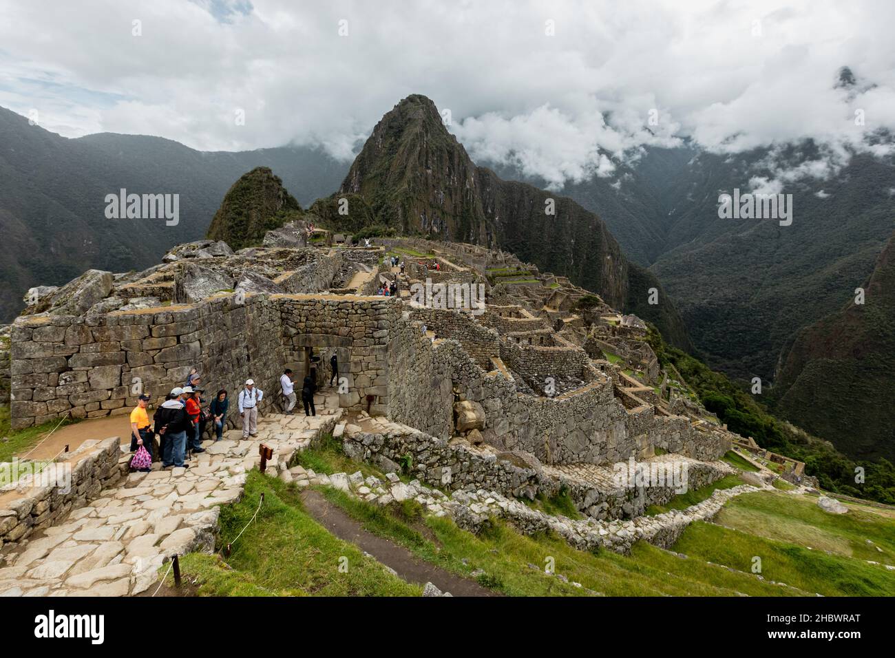 MACHU PICCHU, PERU - MARCH 9, 2019: Crowds of visitors at the ruins of ...