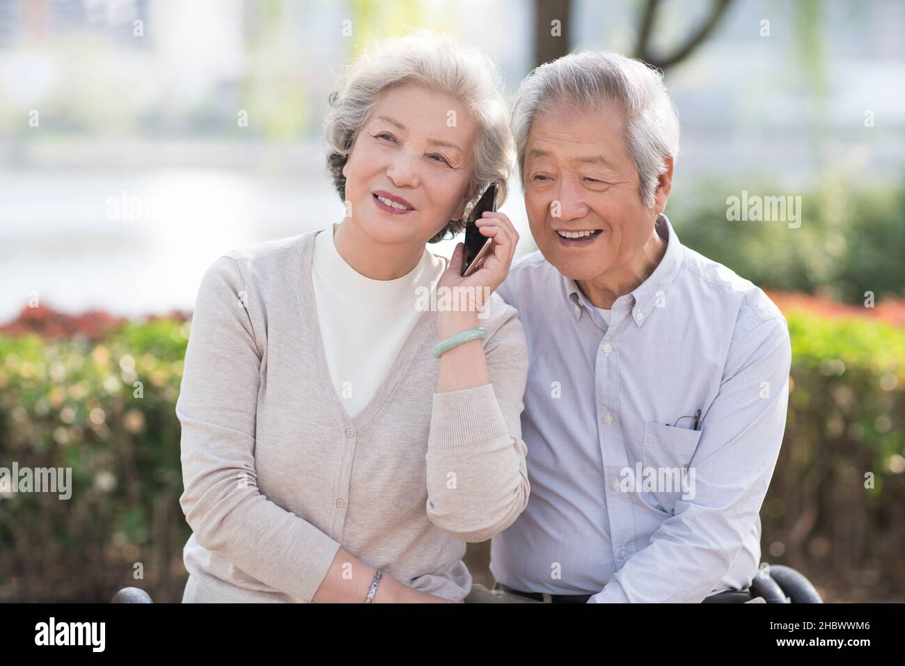 Two hands holding phone hi-res stock photography and images - Alamy