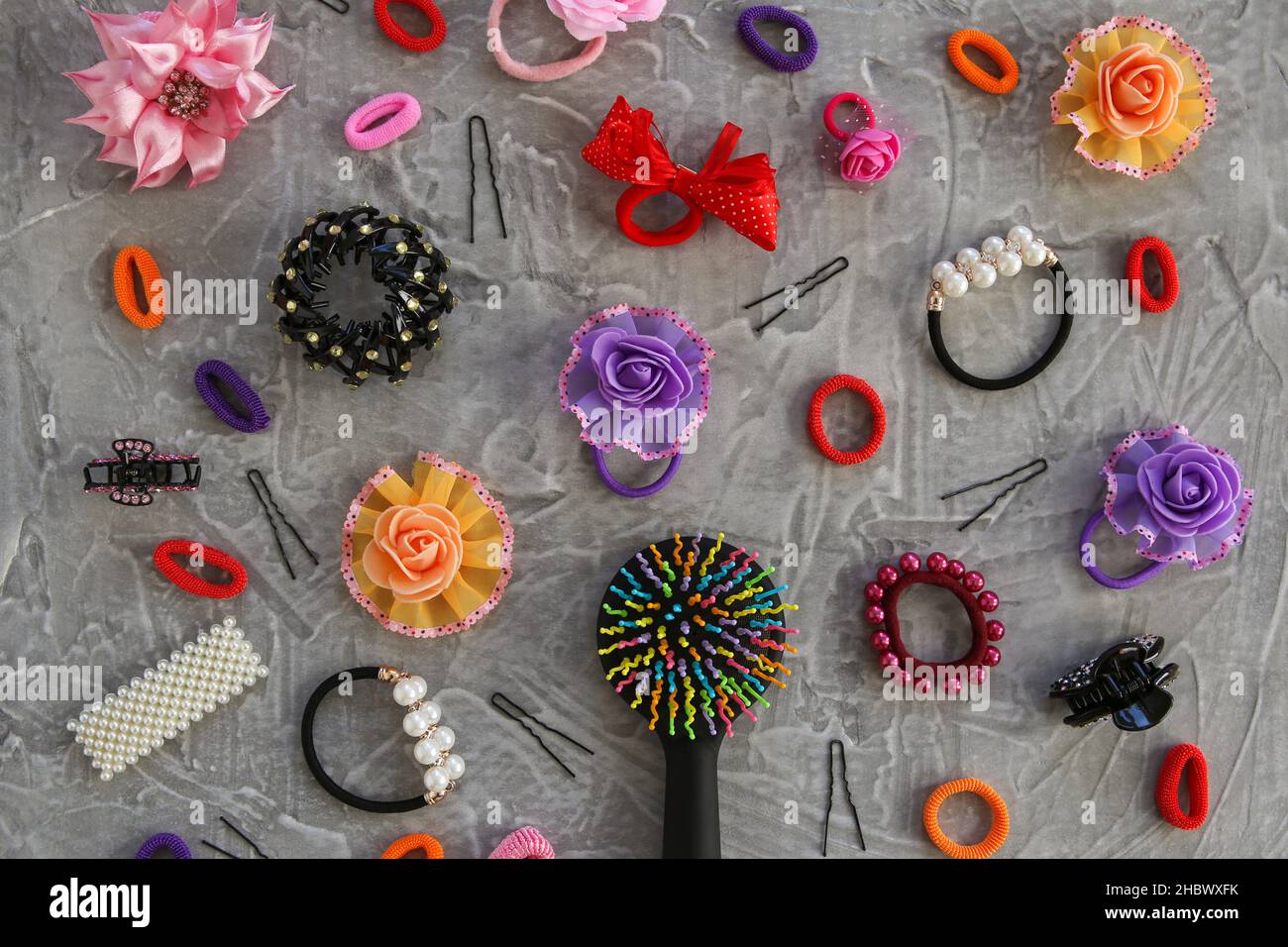 Different hair clips on gray background. Flat lay. Top view Stock Photo ...