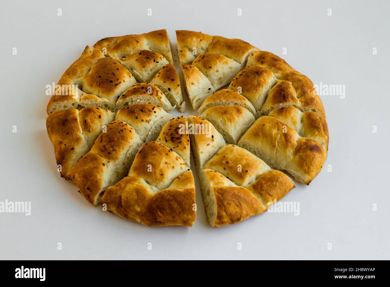 Triangle sliced Ramadan bread,pide on the white background.Above view ...