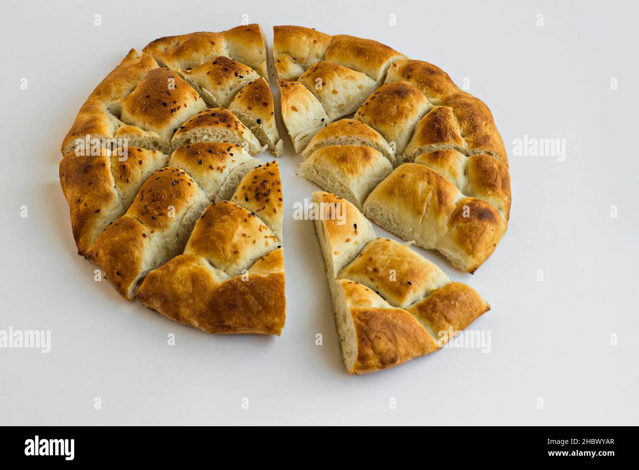 Triangle sliced Ramadan bread,pide on the white background.Above view ...