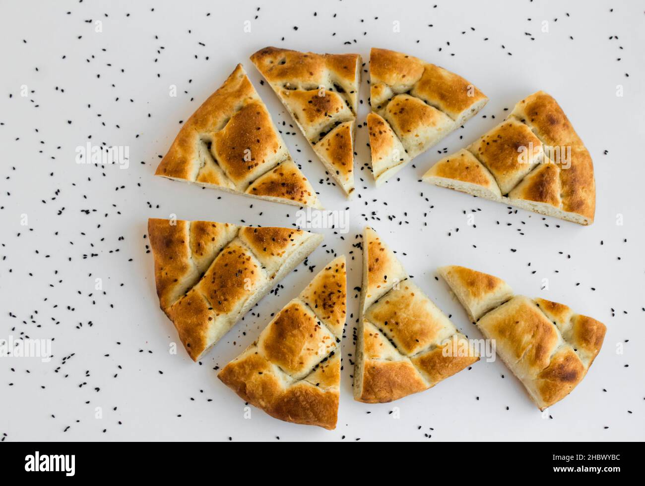 Triangle sliced Ramadan bread,pide on the white background.Above view ...