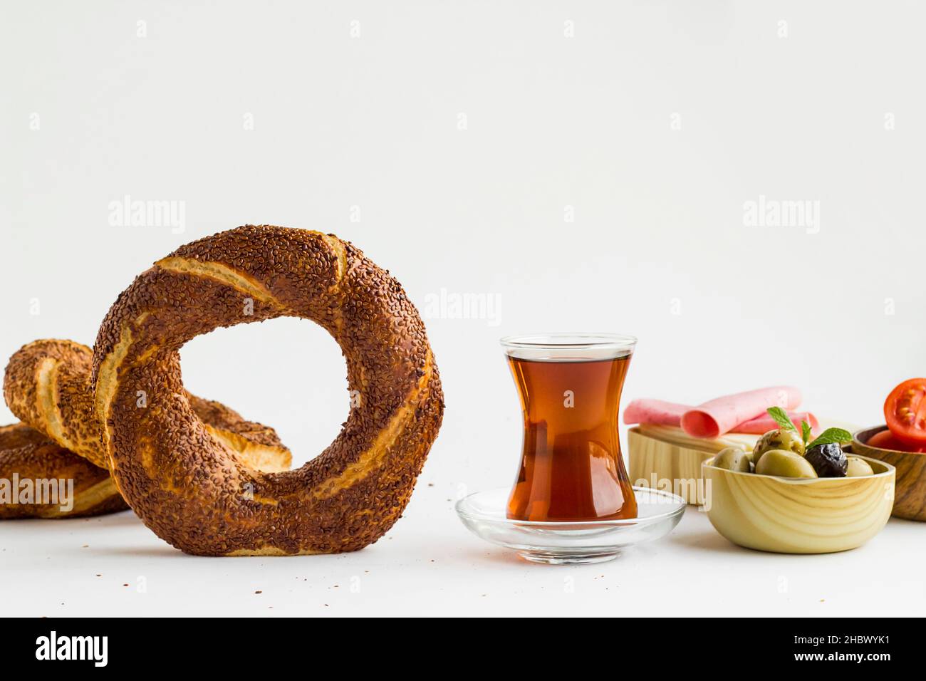 Traditional Turkish crispy sesame bagel Simit,stand on the white ...