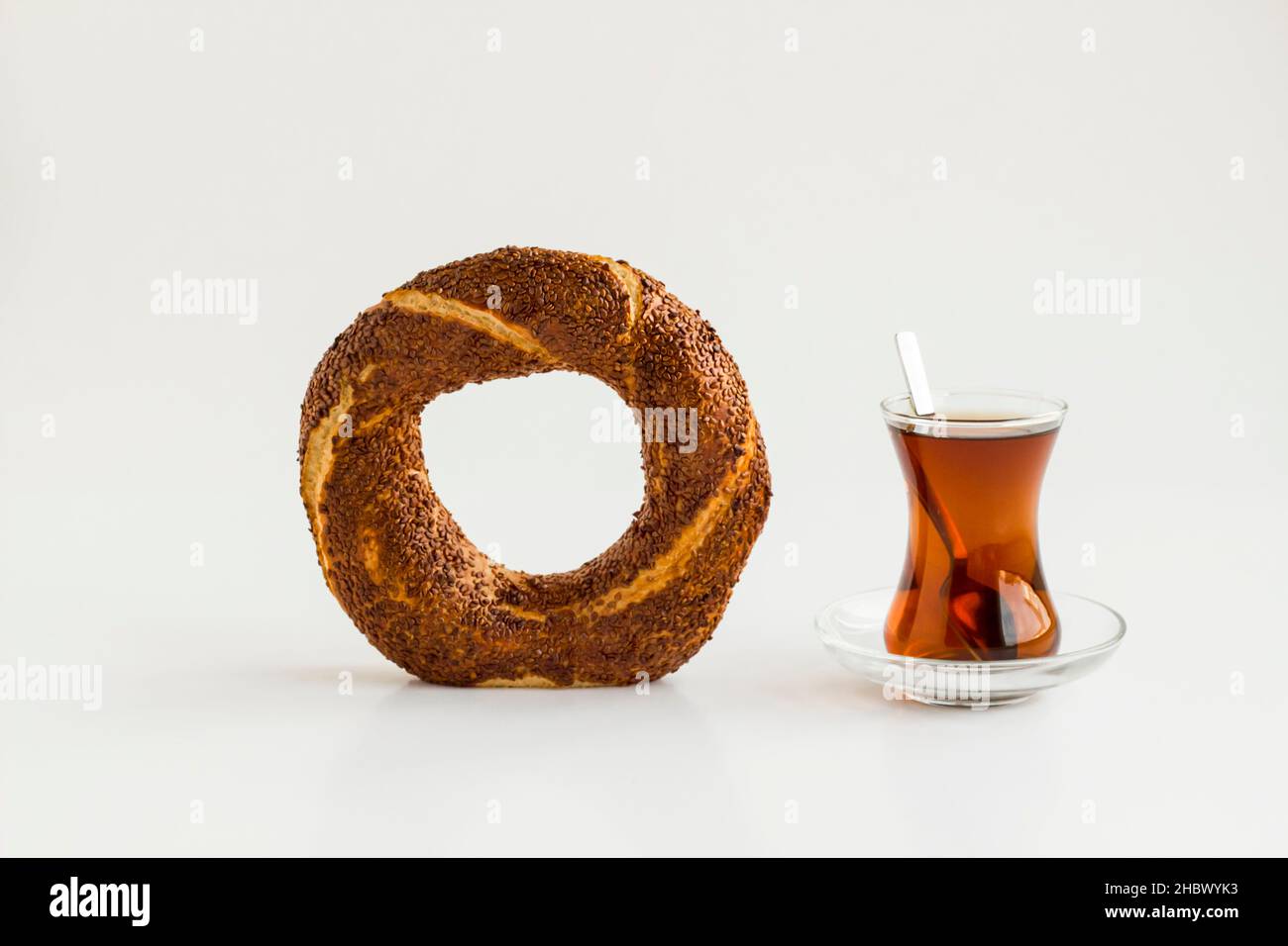Traditional Turkish crispy sesame bagel Simit,stand on the white ...