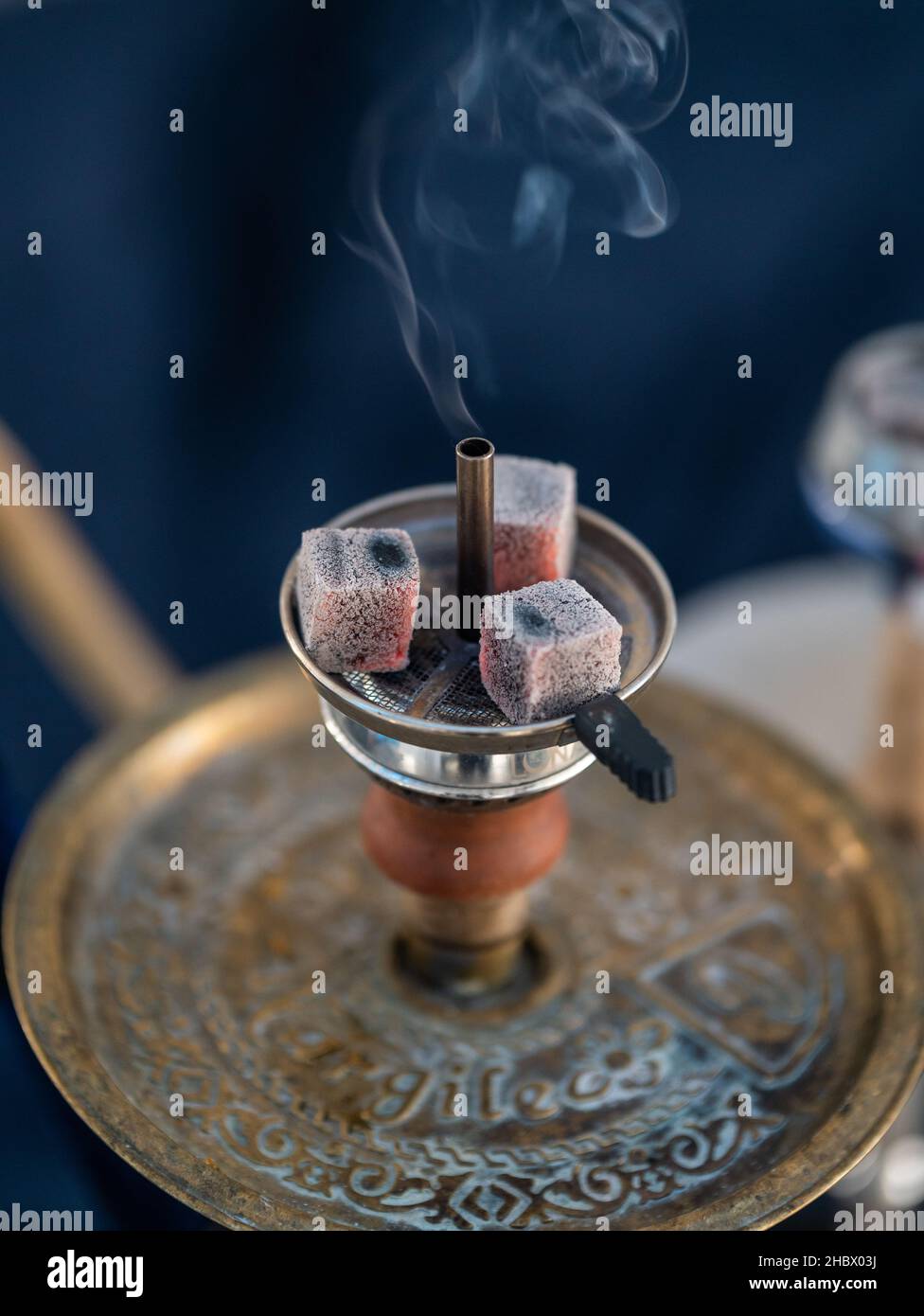 Rottweil, Germany. 19th Dec, 2021. Shisha coal lies on a chimney top of ...