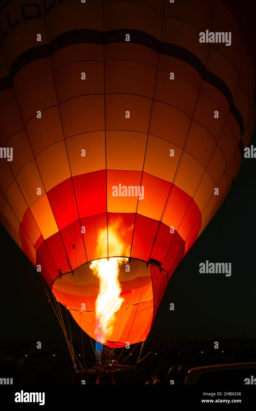 Hot air balloon fire burner at night. Glowing flames of burner in a hot ...