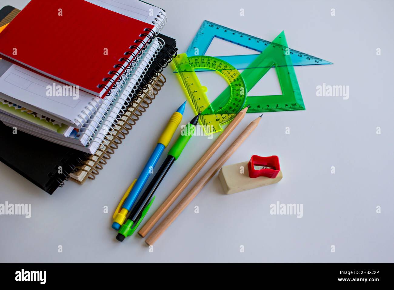 Colorful school supplies,spiral notebooks,pencils and protractors on ...