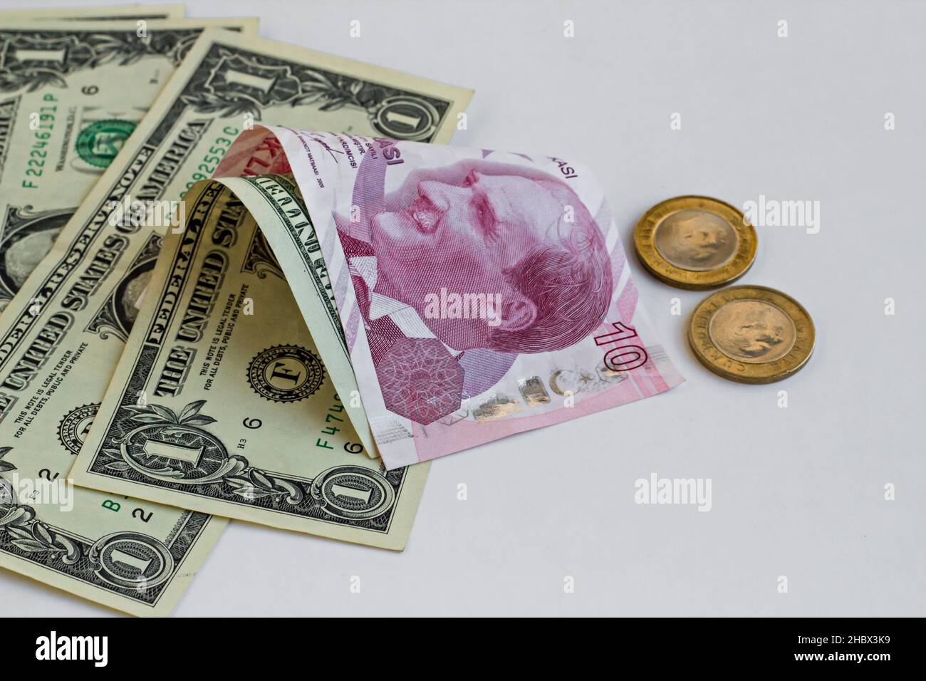 Ten Lira Banknote Of Turkish Liras backward curved on one dollar ...