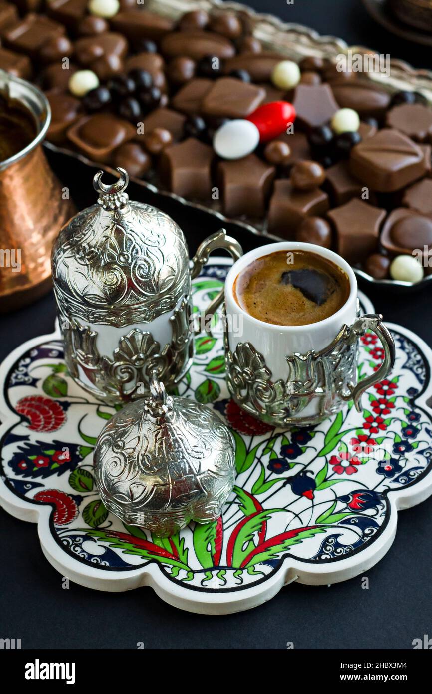 Traditional Turkish Coffee With Chocolate on the black surface with ...