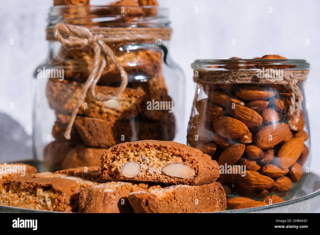 Traditional Italian cantuccini cookies with almonds in glass jar. Sweet ...