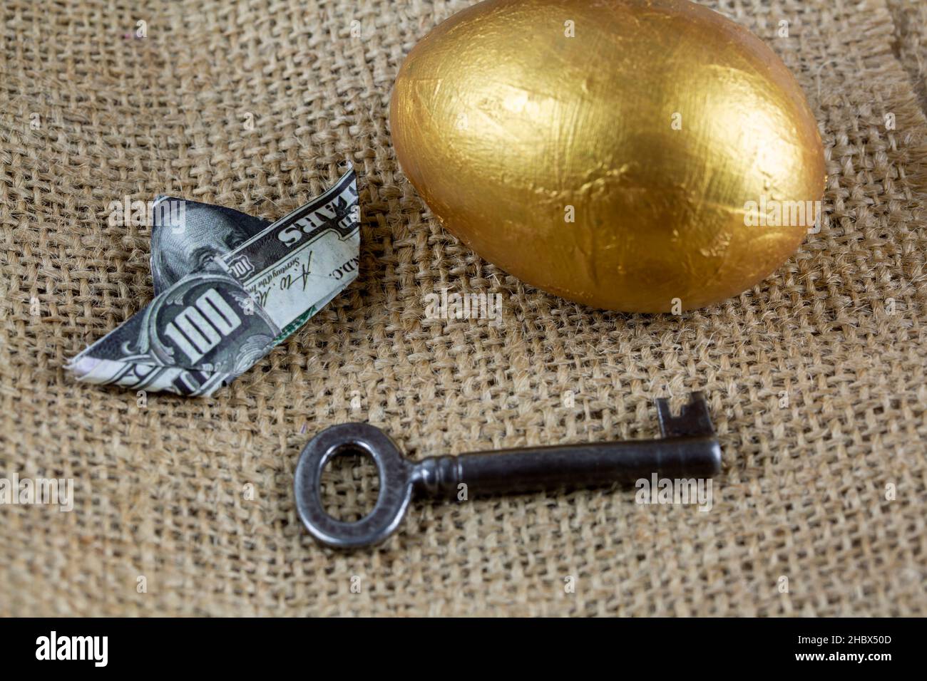 Golden Egg and Dollar , Savings Concept Stock Photo - Alamy