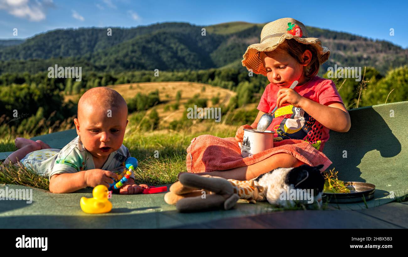 Children playing at a campsite in the mountains Stock Photo - Alamy