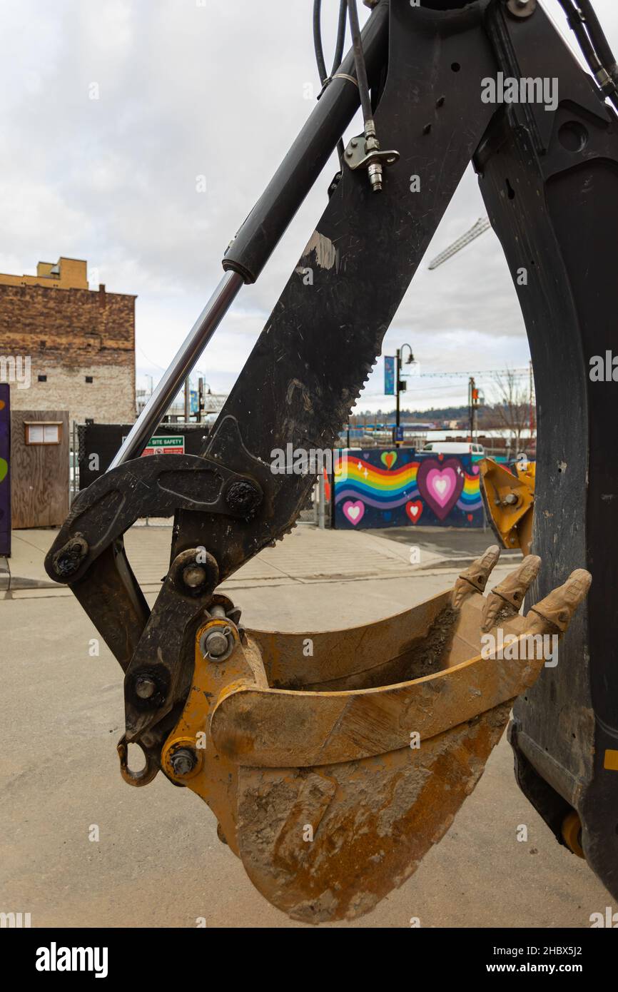 An excavator bucket close up. Working with excavator at road ...