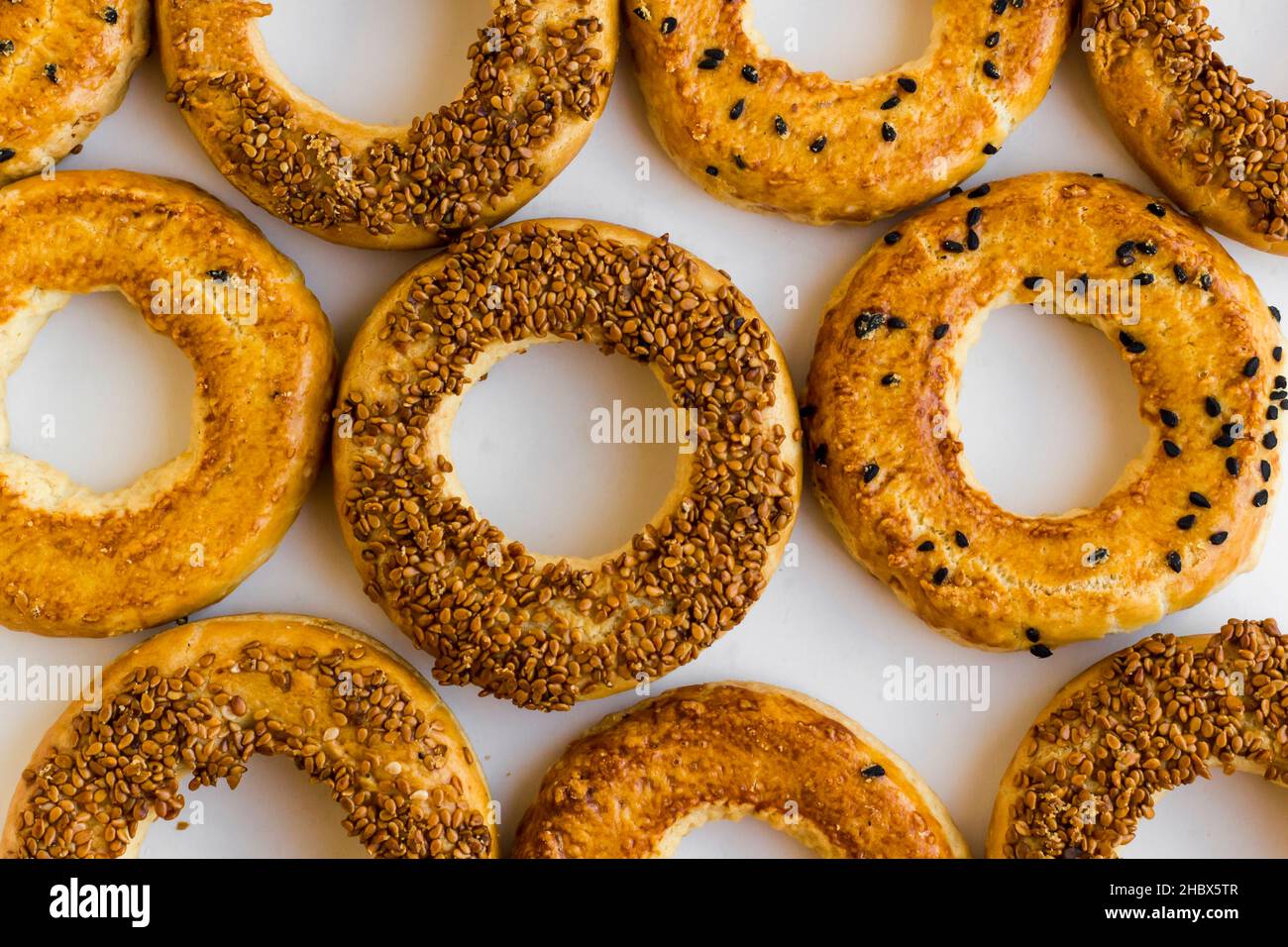 Traditional Turkish Sesame Rings Kandil Simidi on the white surface ...