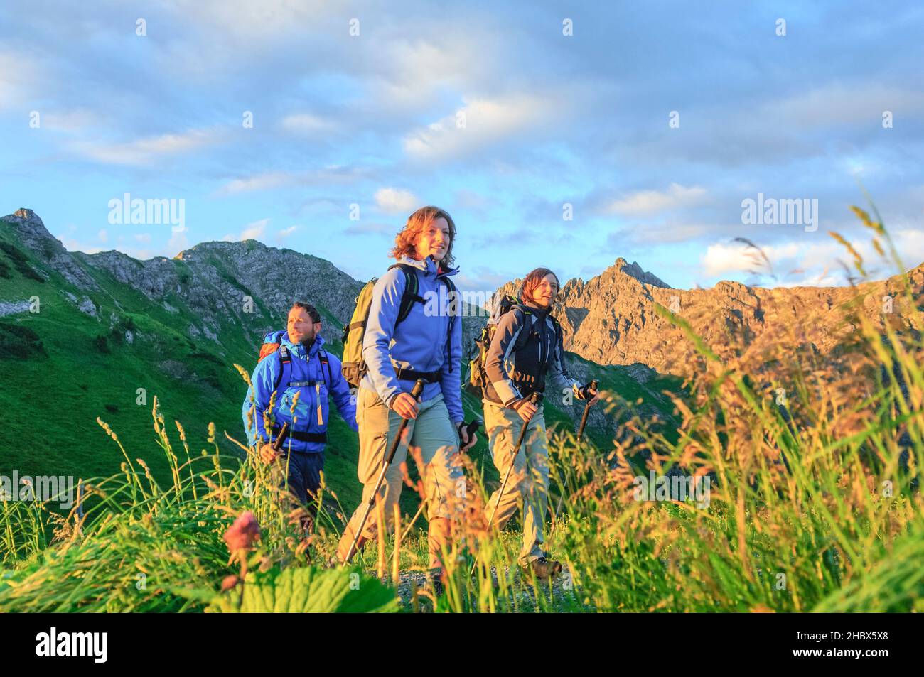 Three Hikers doing a tour in early morning hours Stock Photo - Alamy