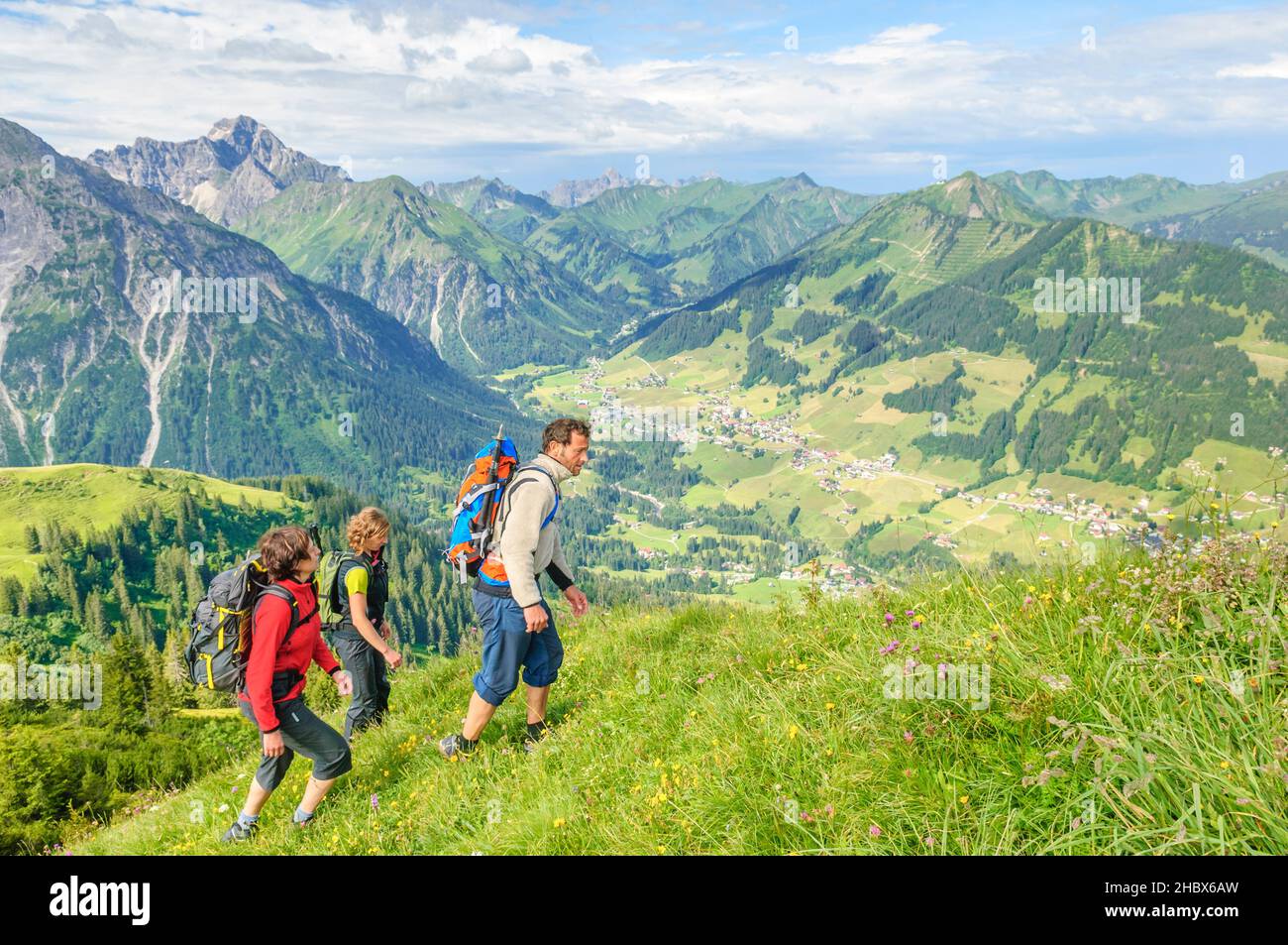Hikers enjoying the nice alpine scenery Stock Photo - Alamy