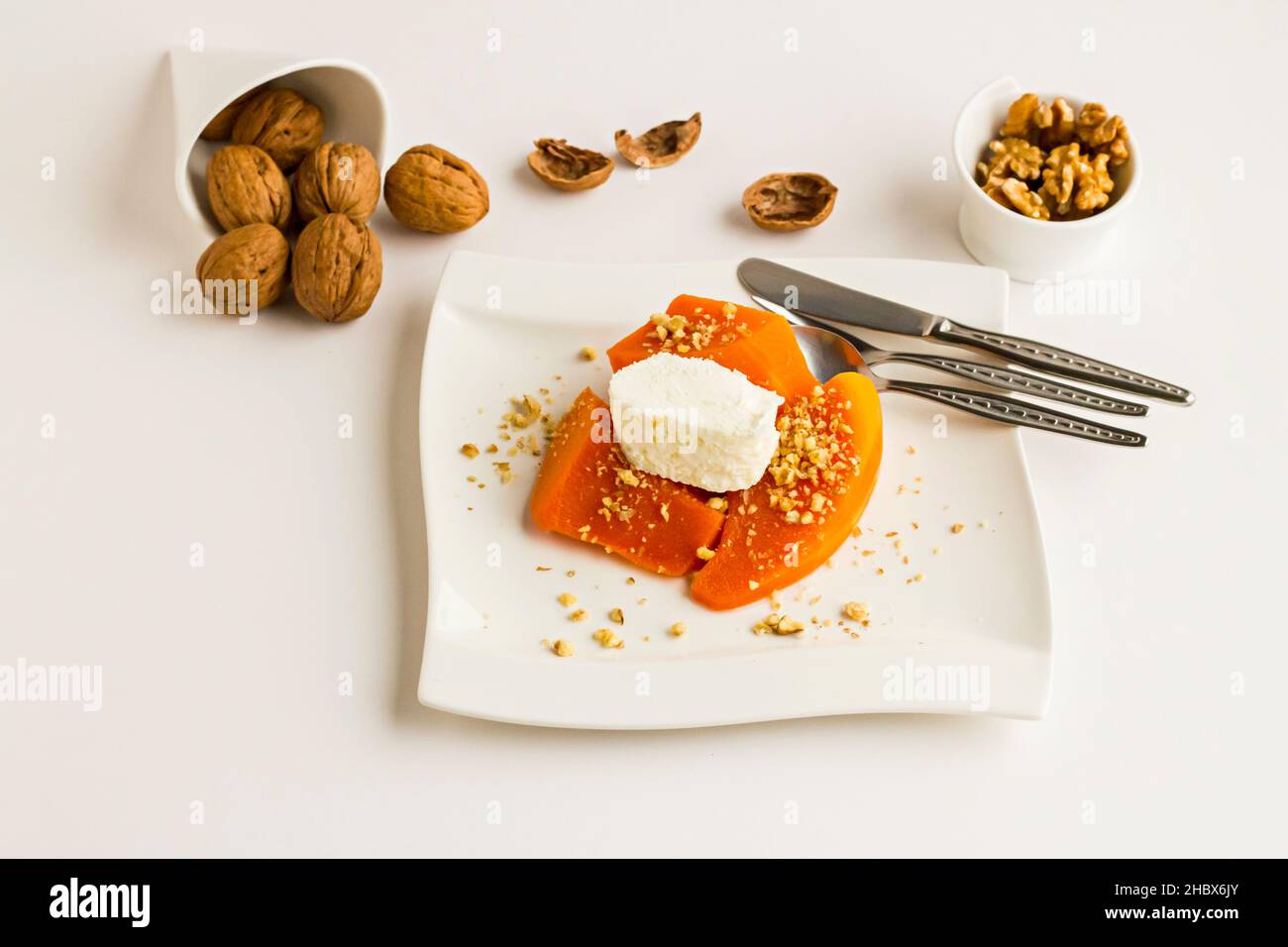 Traditional Turkish pumpkin dessert,creamy,kaymak and chopped walnuts ...