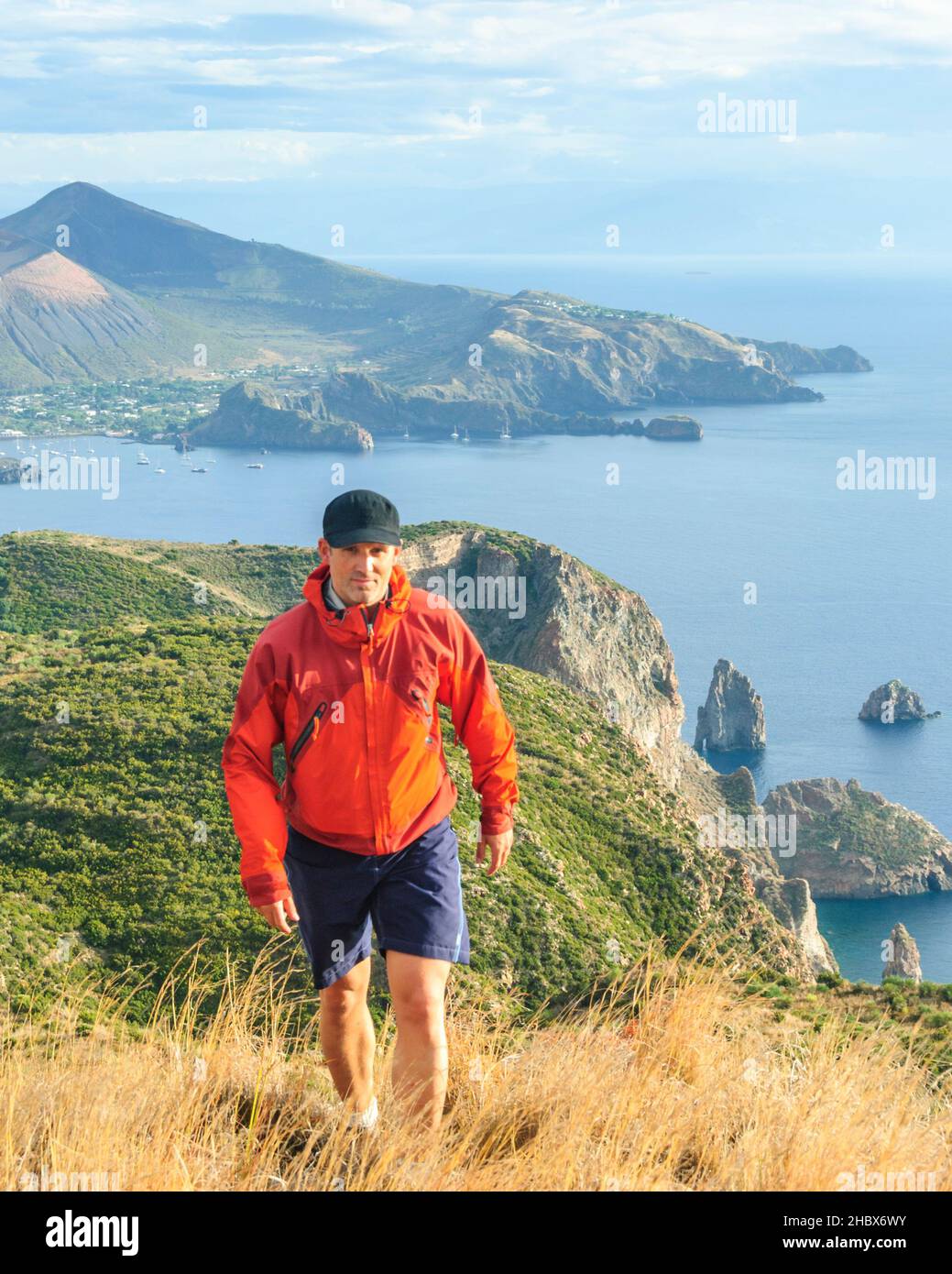 Good humoured man hiking on Lipari island Stock Photo - Alamy