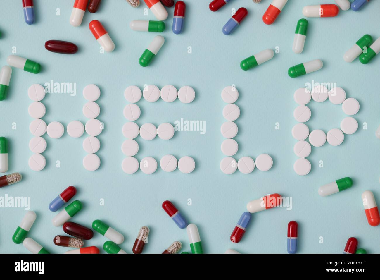 Help lettering made with white round pills, pharmaceutical medicament ...