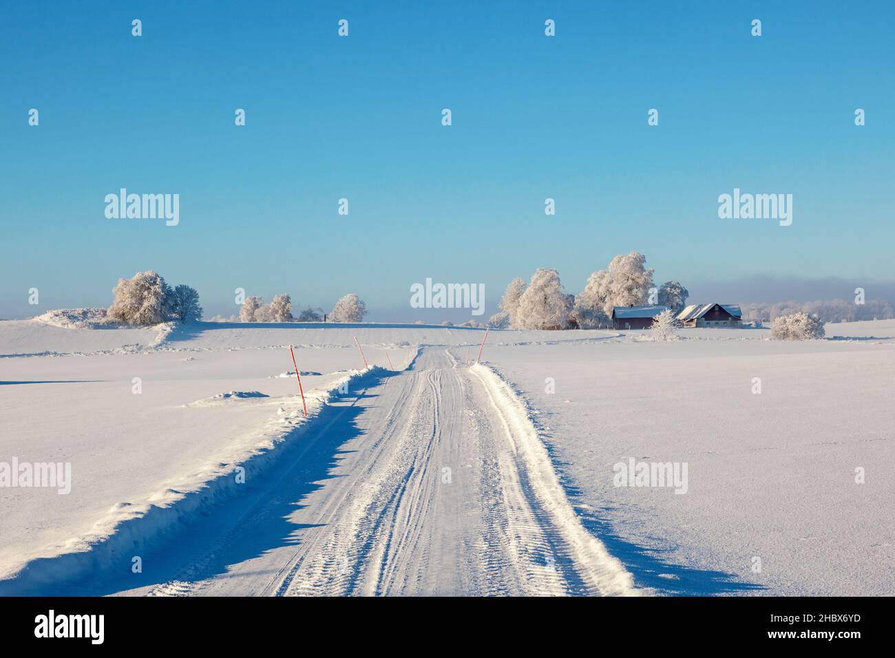 Winter road in snowy countryside landscape Stock Photo - Alamy