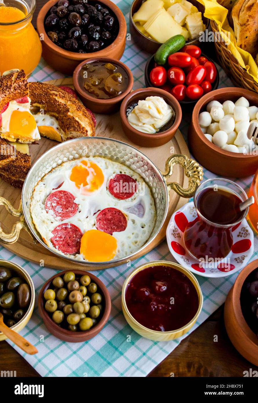 Traditional Turkish Breakfast with sesame bagel and fried egg with ...