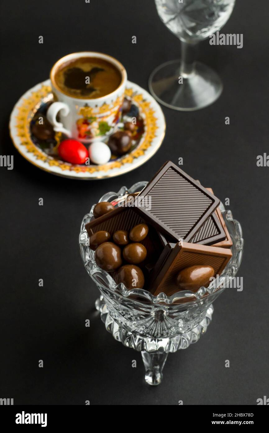 Two kinds of madlen chocolate in a bowl with Traditional Turkish Coffee ...