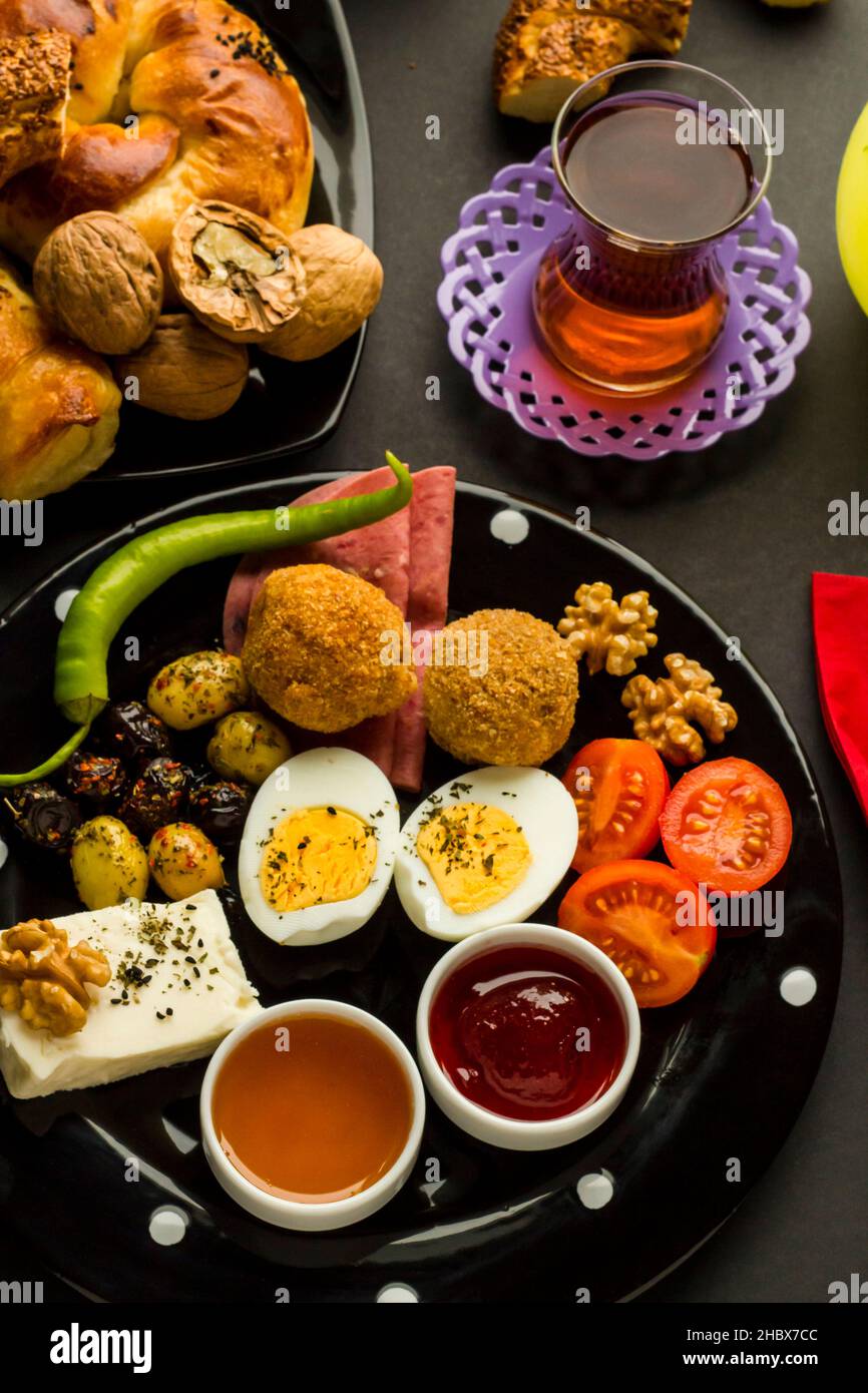 Traditional Turkish Breakfast Big Plate on black surface with sesame ...