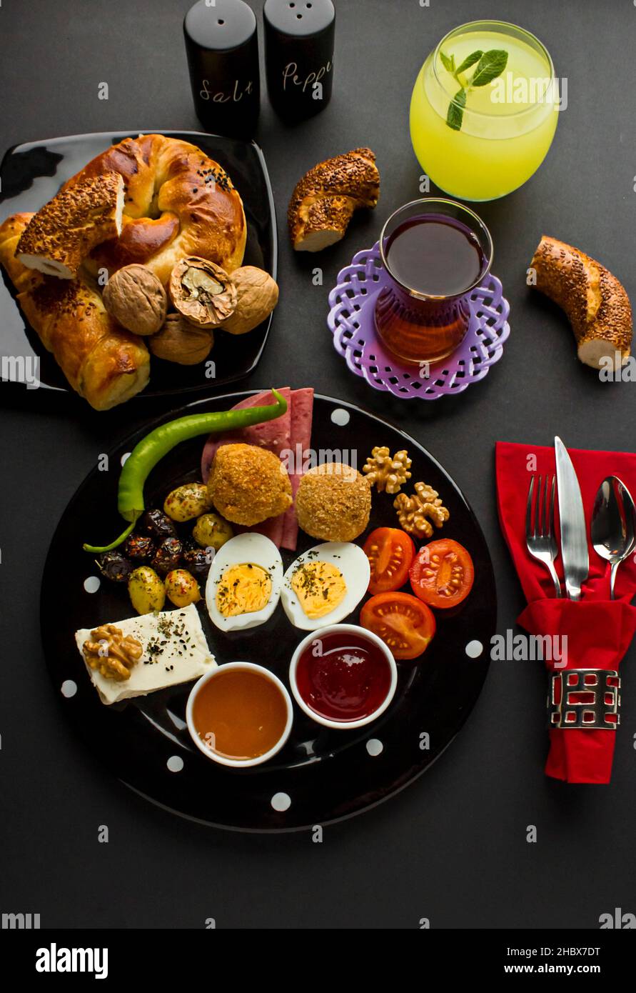 Traditional Turkish Breakfast Big Plate on black surface with sesame ...