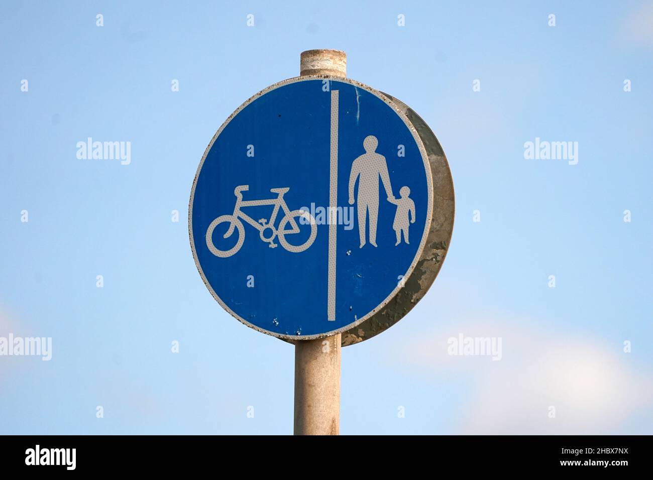 Sign depicting a shared bike path and pedestrian way Stock Photo - Alamy