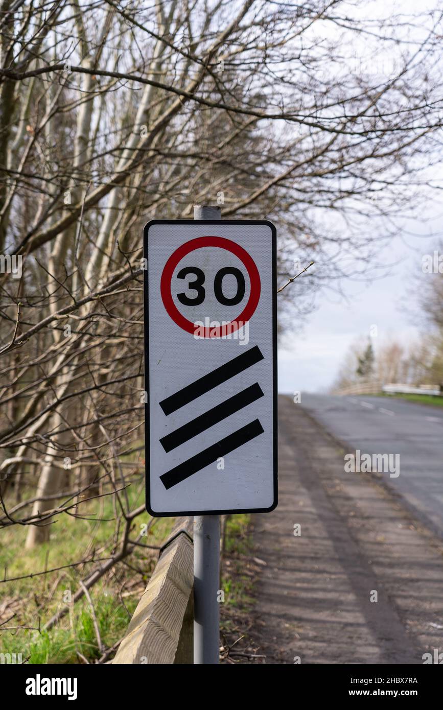 Entering 30 MPH Zone sign. Poverty Lane. Maghull Stock Photo - Alamy