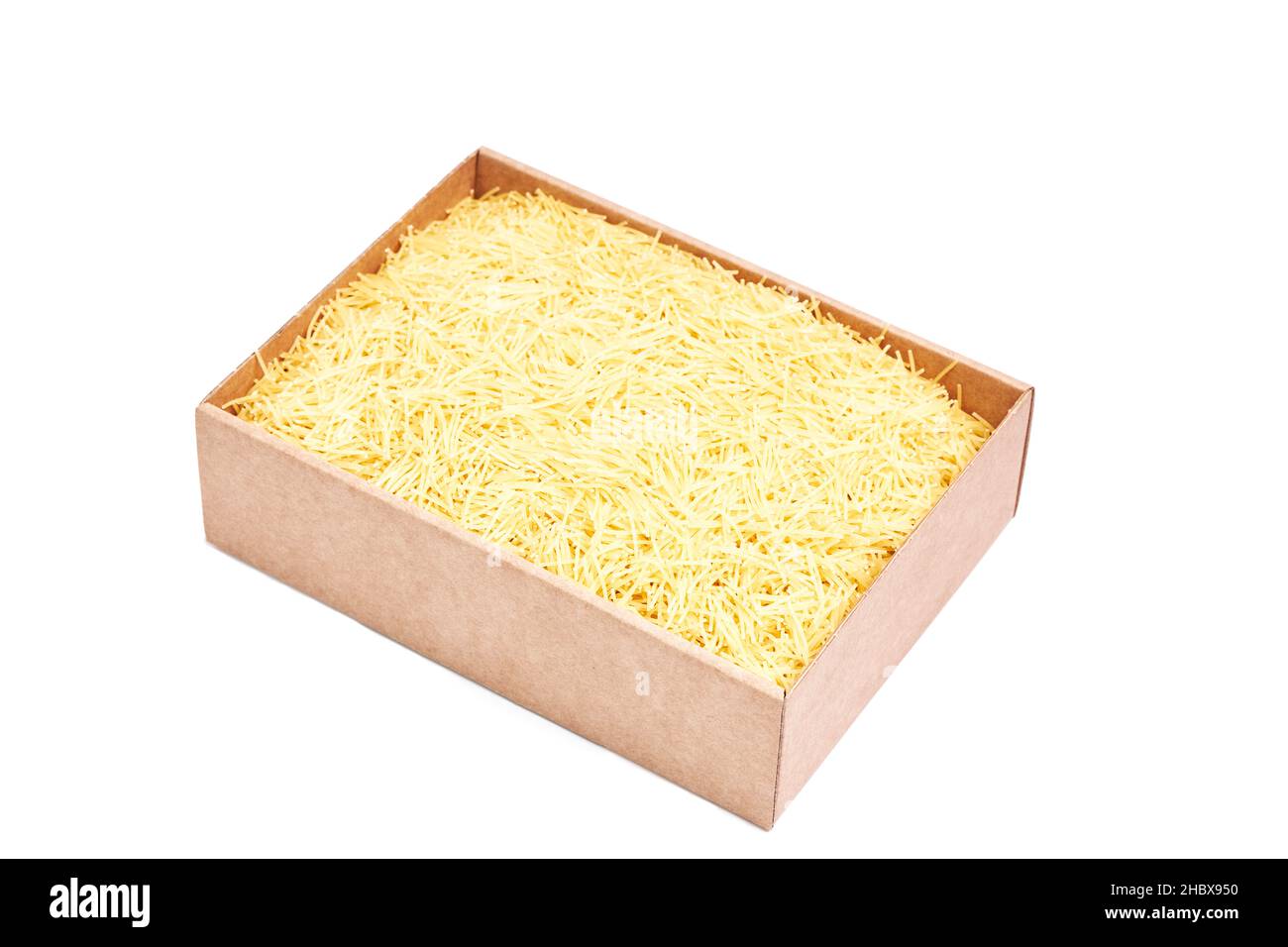 Cardboard box filled with raw noodles on a white background. Pasta ...
