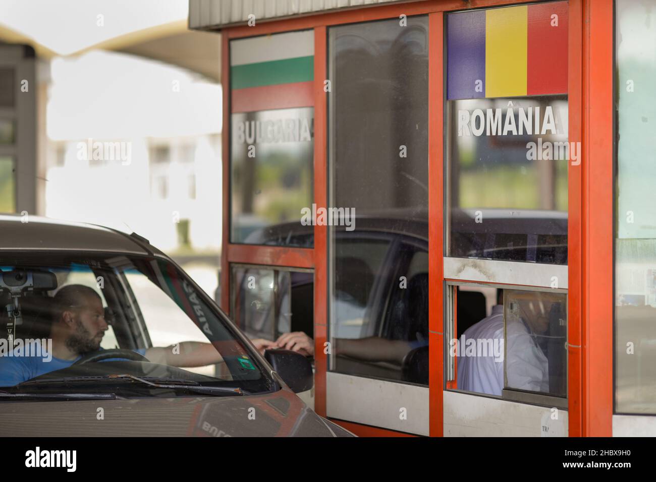 Giurgiu, Romania - July 1, 2021: Drivers show the border police officer ...