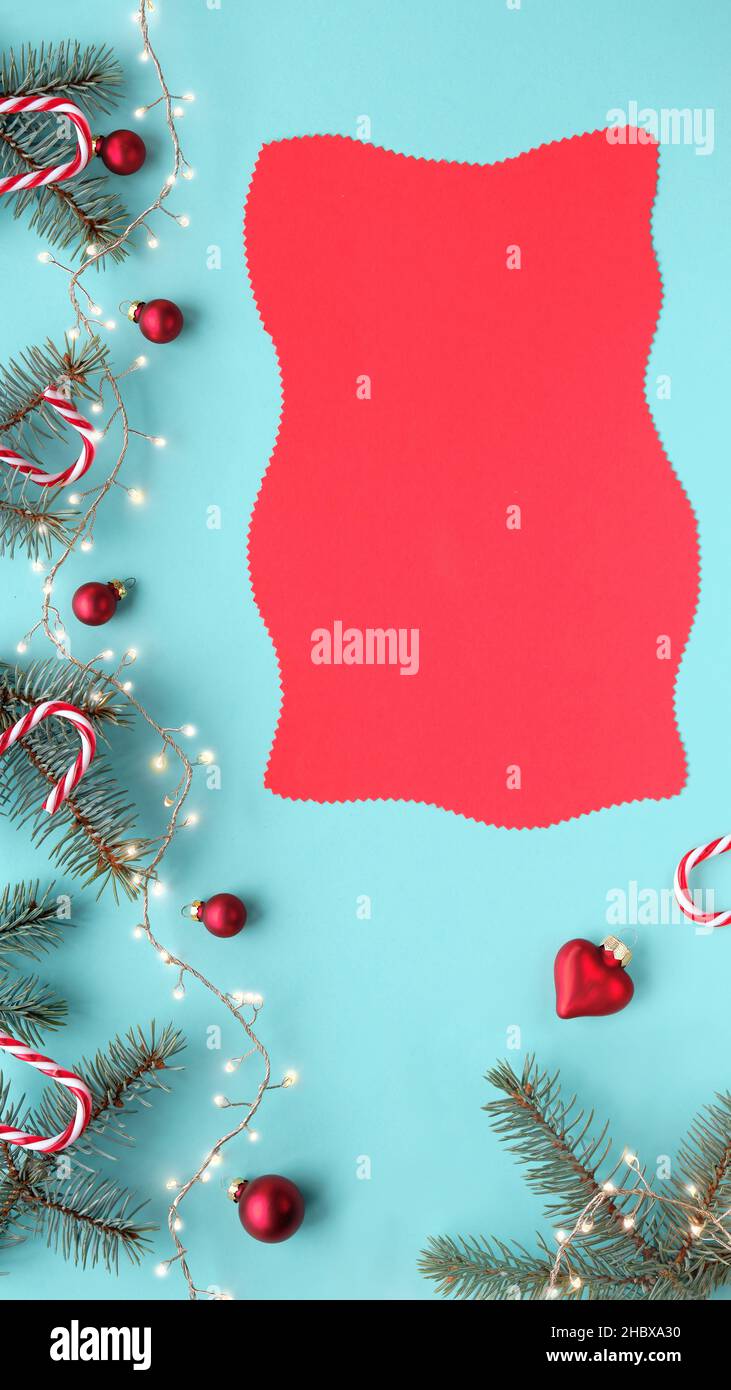 Winter background in mint blue and red. Decorative border, fir twigs ...