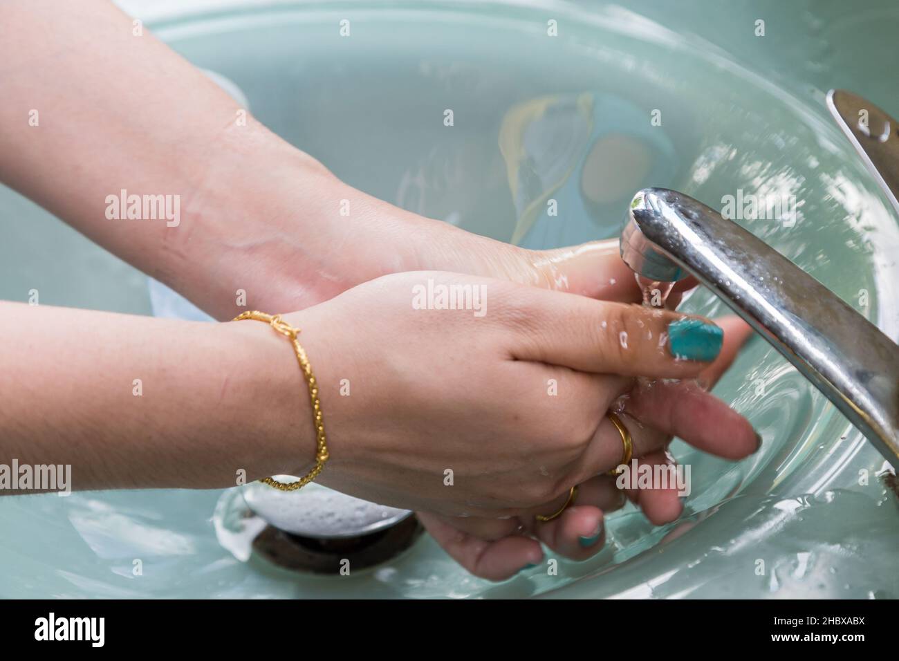 Washing of hands with soap under running water Stock Photo - Alamy