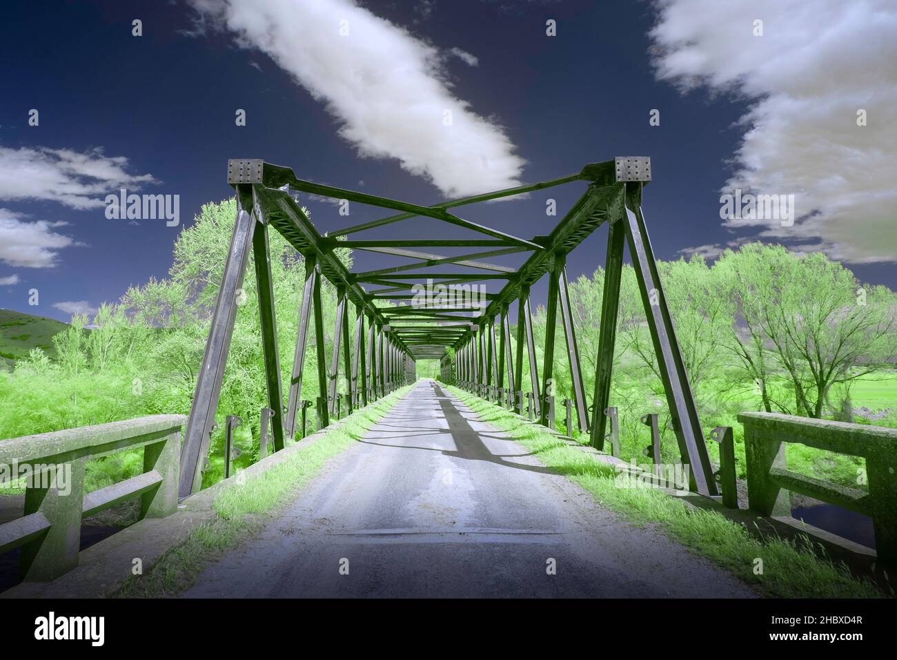 Infrared landscape scene of an old steel bridge Stock Photo - Alamy