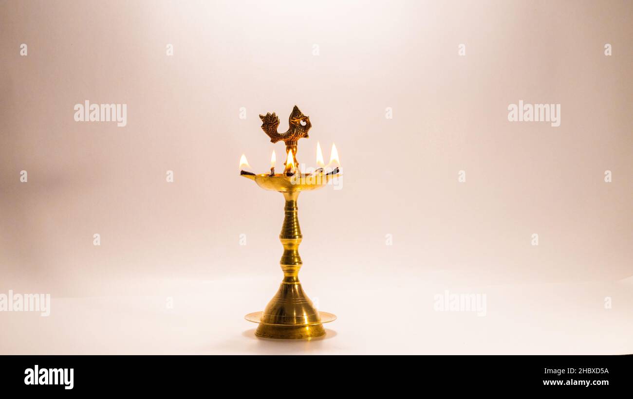 A Closeup Of Nilavilakku Traditional Lamp Used Commonly In Kerala As Well As In Tamil Nadu a-closeup-of-nilavilakku-traditional-lamp-used-commonly-in-kerala-as-well-as-in-tamil-nadu