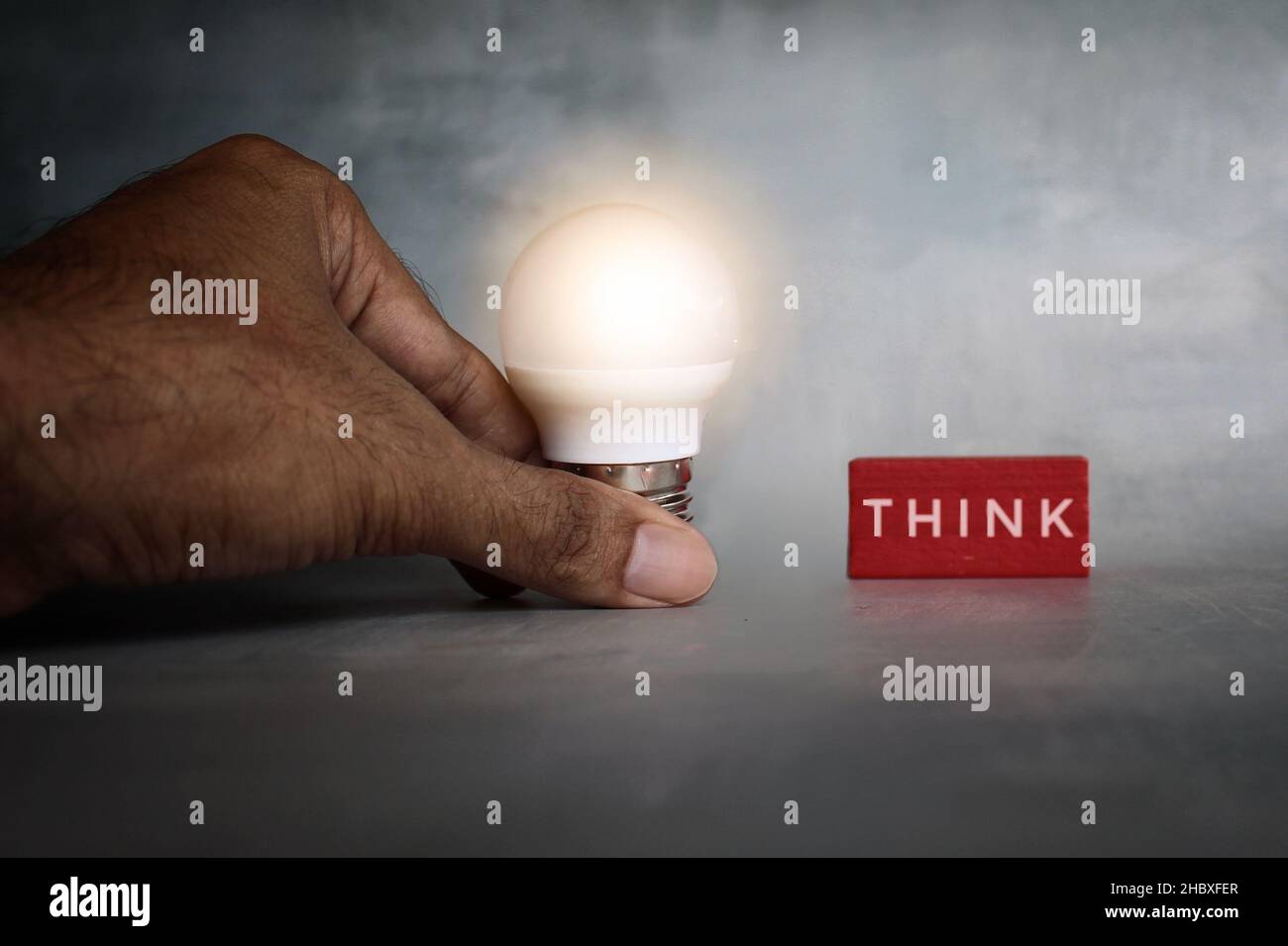Hand holding lightbulb hi-res stock photography and images - Alamy